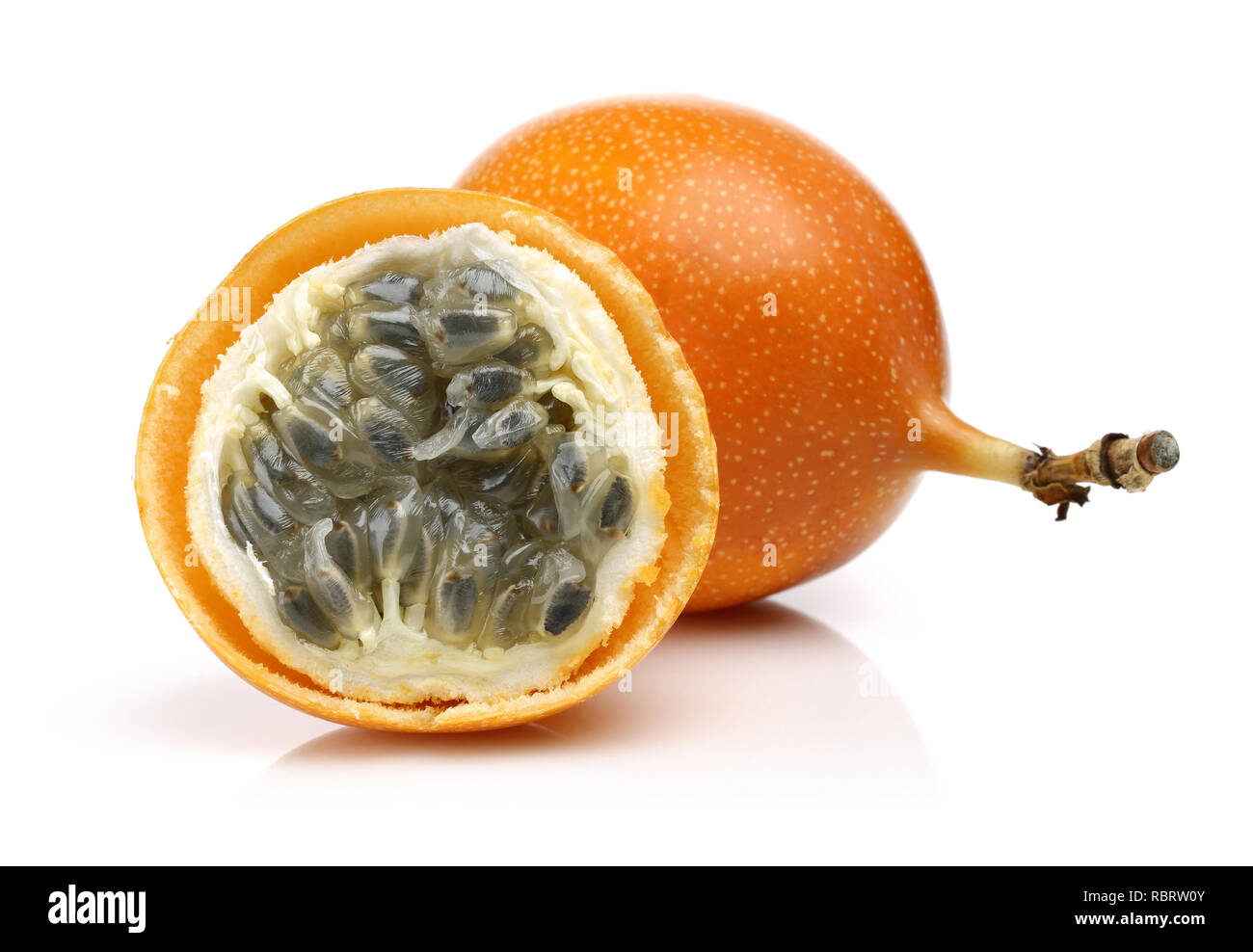 Ripe juicy whole and half granadilla isolated on white background Stock ...