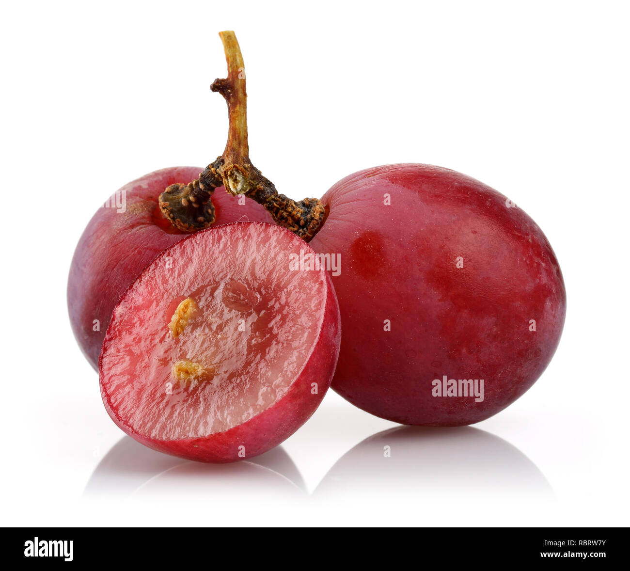 Red grapes and half grape isolated on white background Stock Photo - Alamy