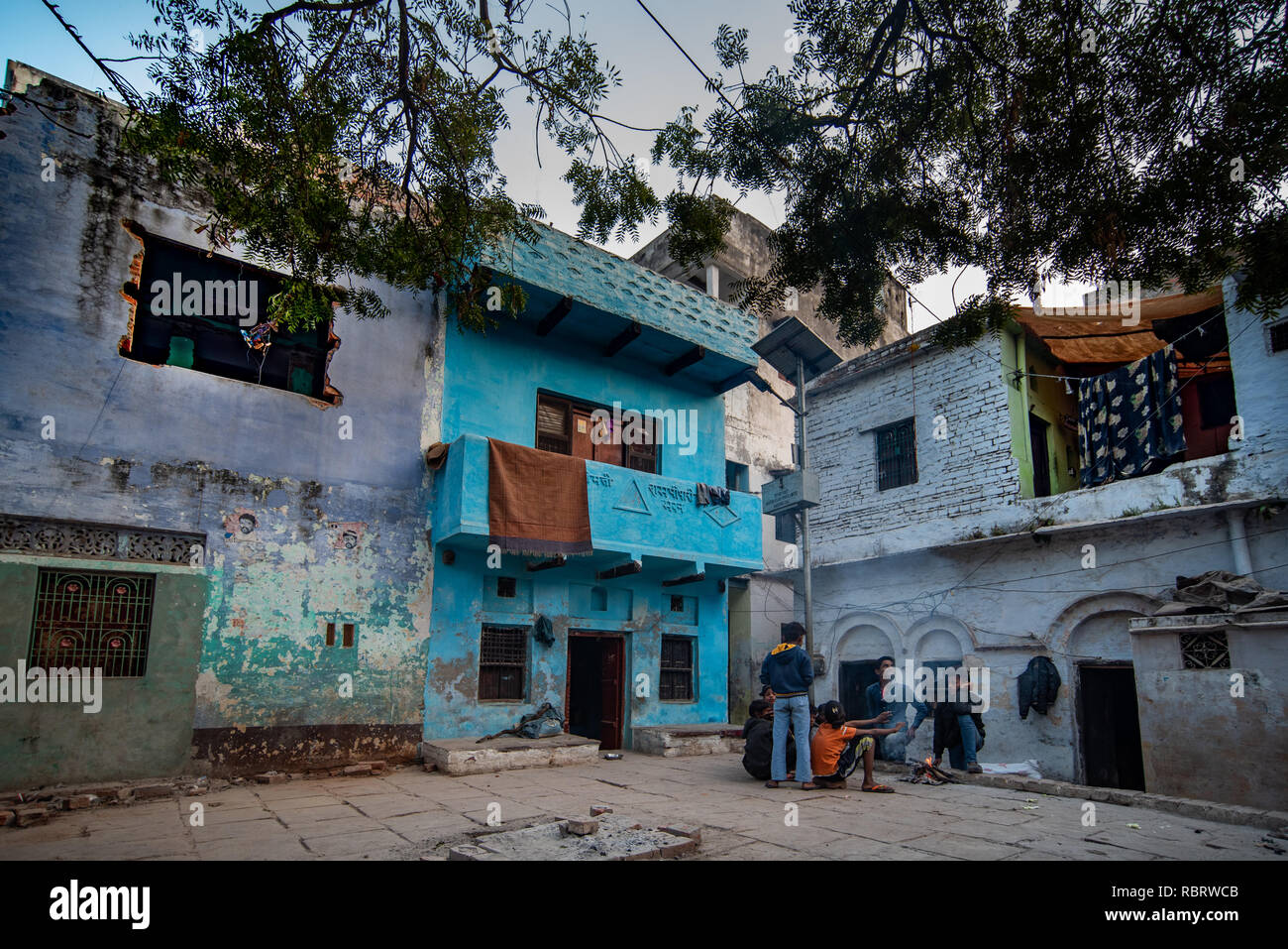 A courtyard surrounded by old historic buildings in Varanasi, India ...