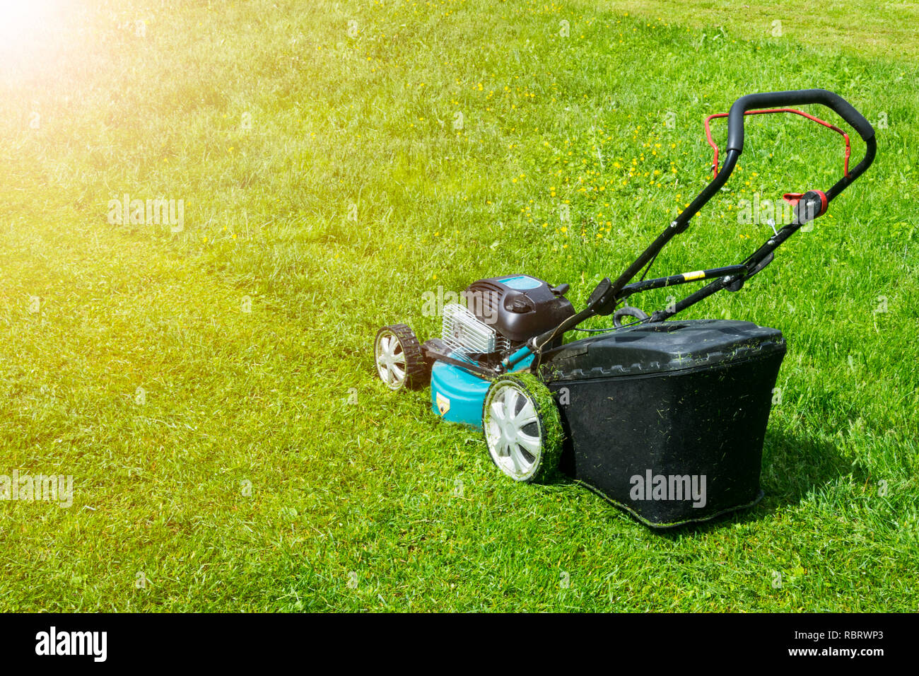 Mowing lawns. Lawn mower on green grass. mower grass equipment. mowing ...