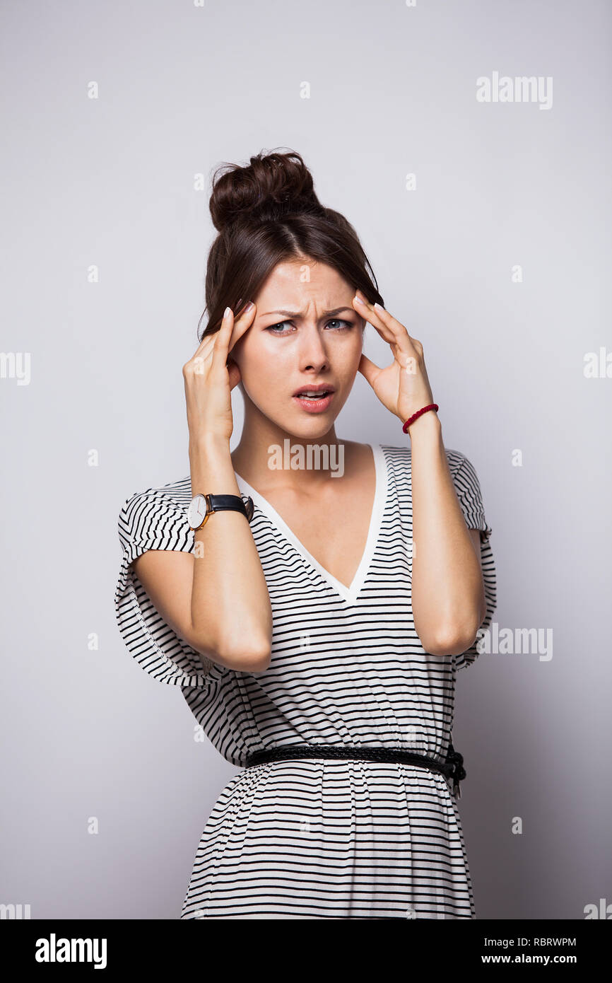 Thinking, tired or ill with headache young woman, isolated over white ...