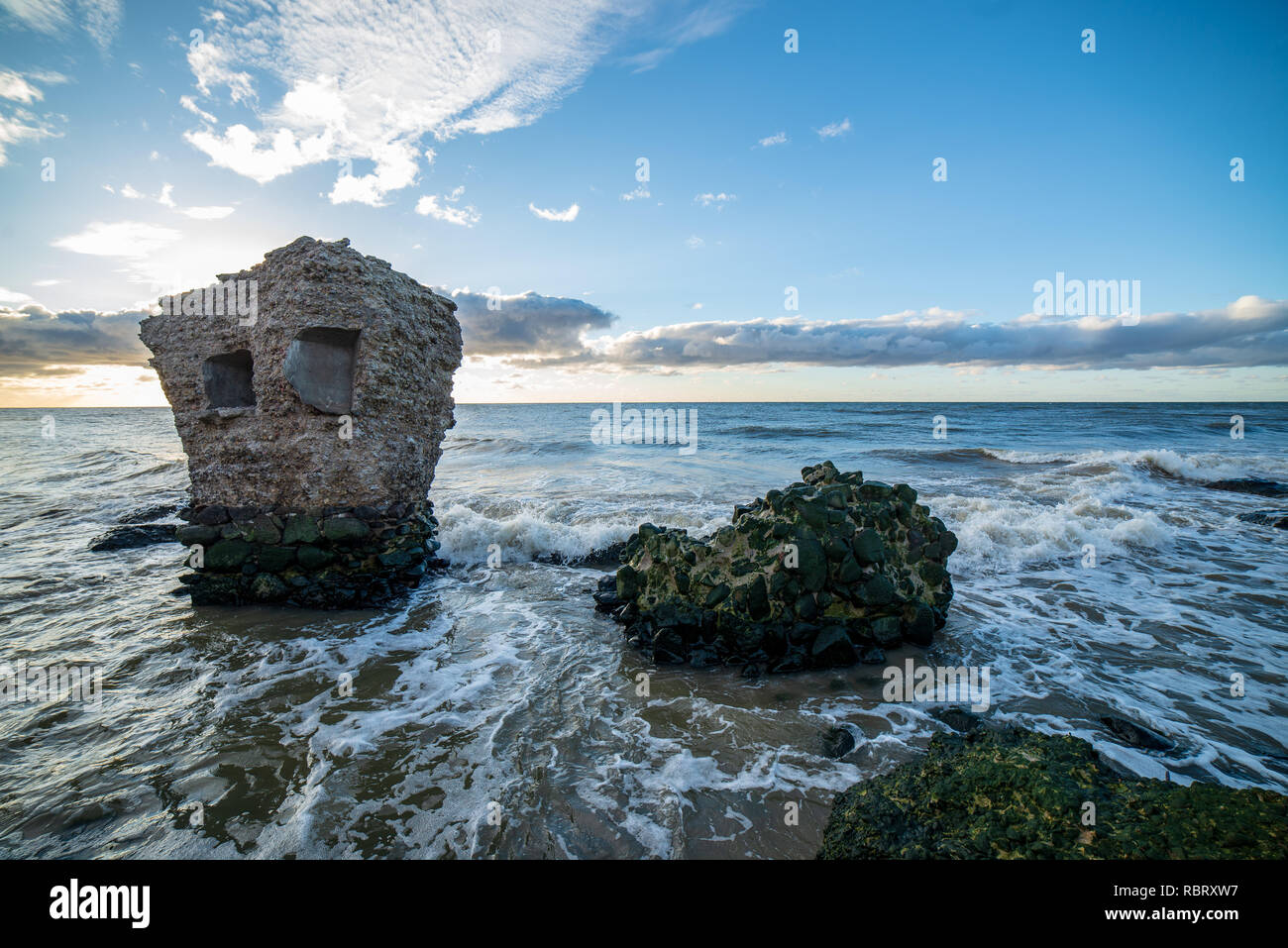 ruins of old war fort in Liepaja, Latvia at sunset time in calm sea ...