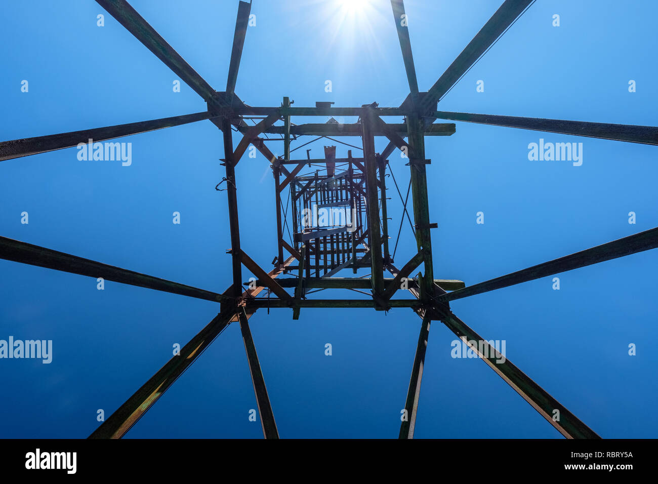 watchtower details and wooden bars, stairs and walls from below up ...