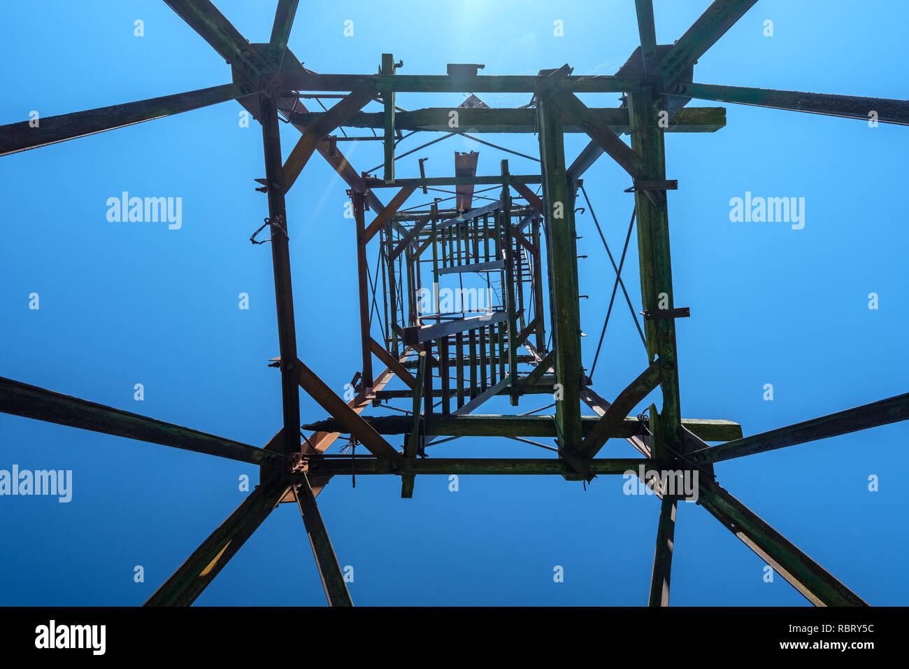 watchtower details and wooden bars, stairs and walls from below up ...