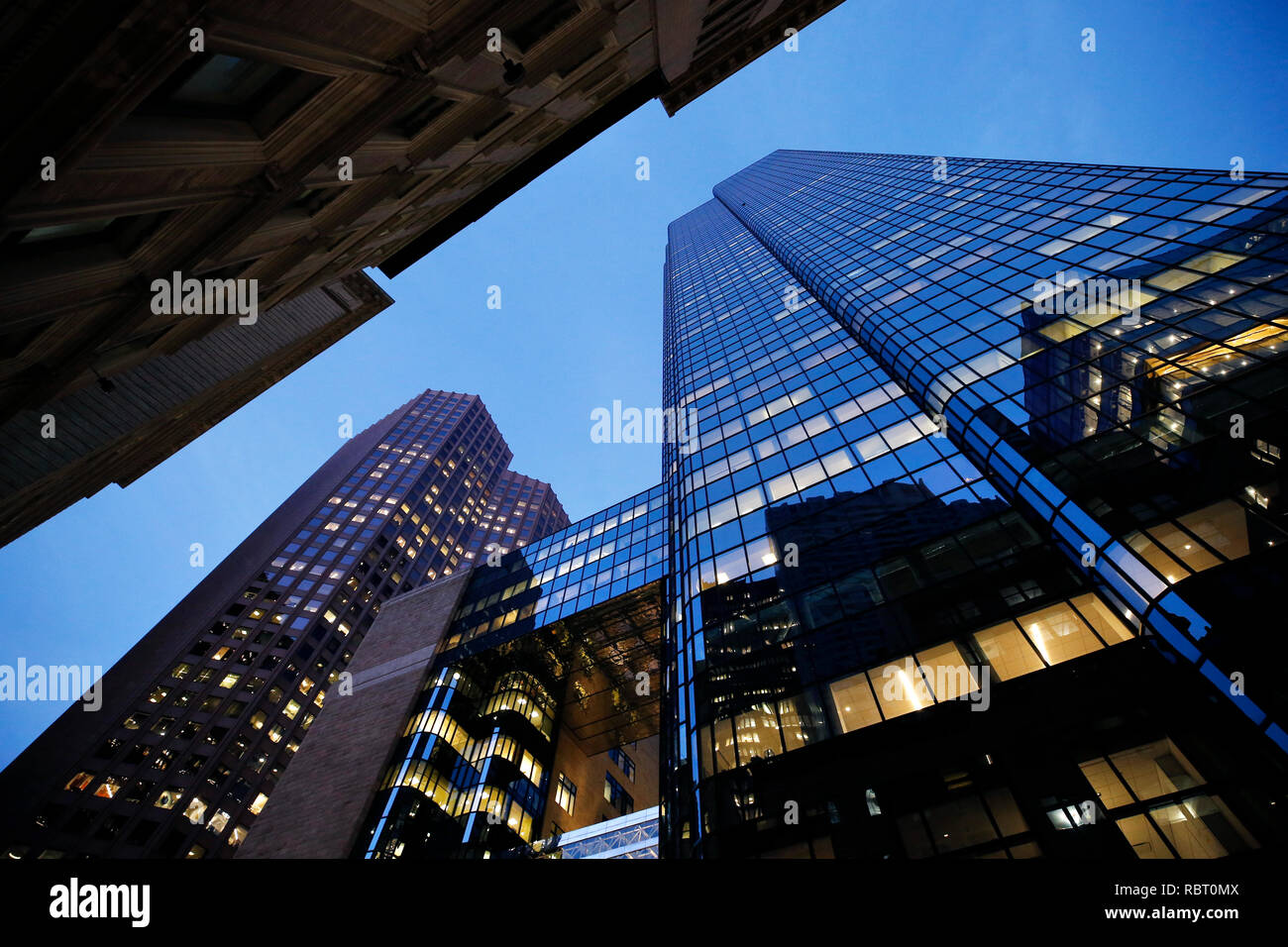 Downtown Boston office buildings from street level, dusk, blue hour ...
