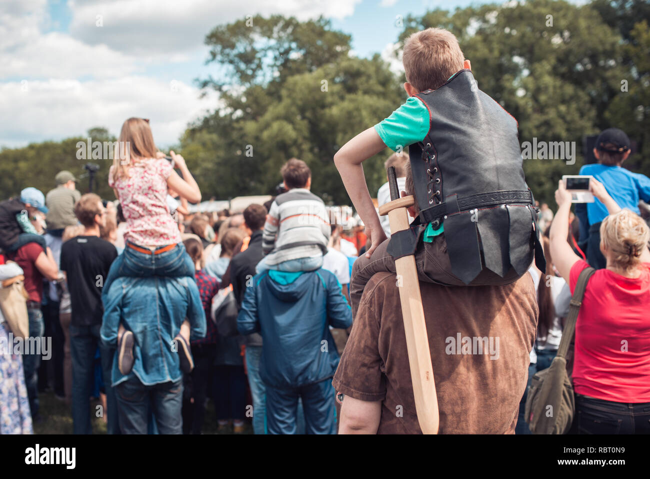 happy family on a festival. fathers, mothers and theirs children ...