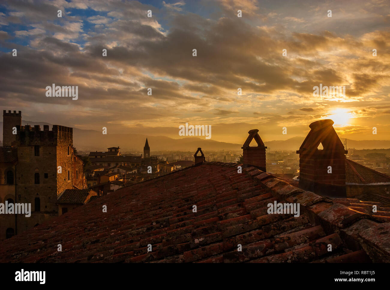 View of Arezzo historic center sunset skyline with medieval towers and ...