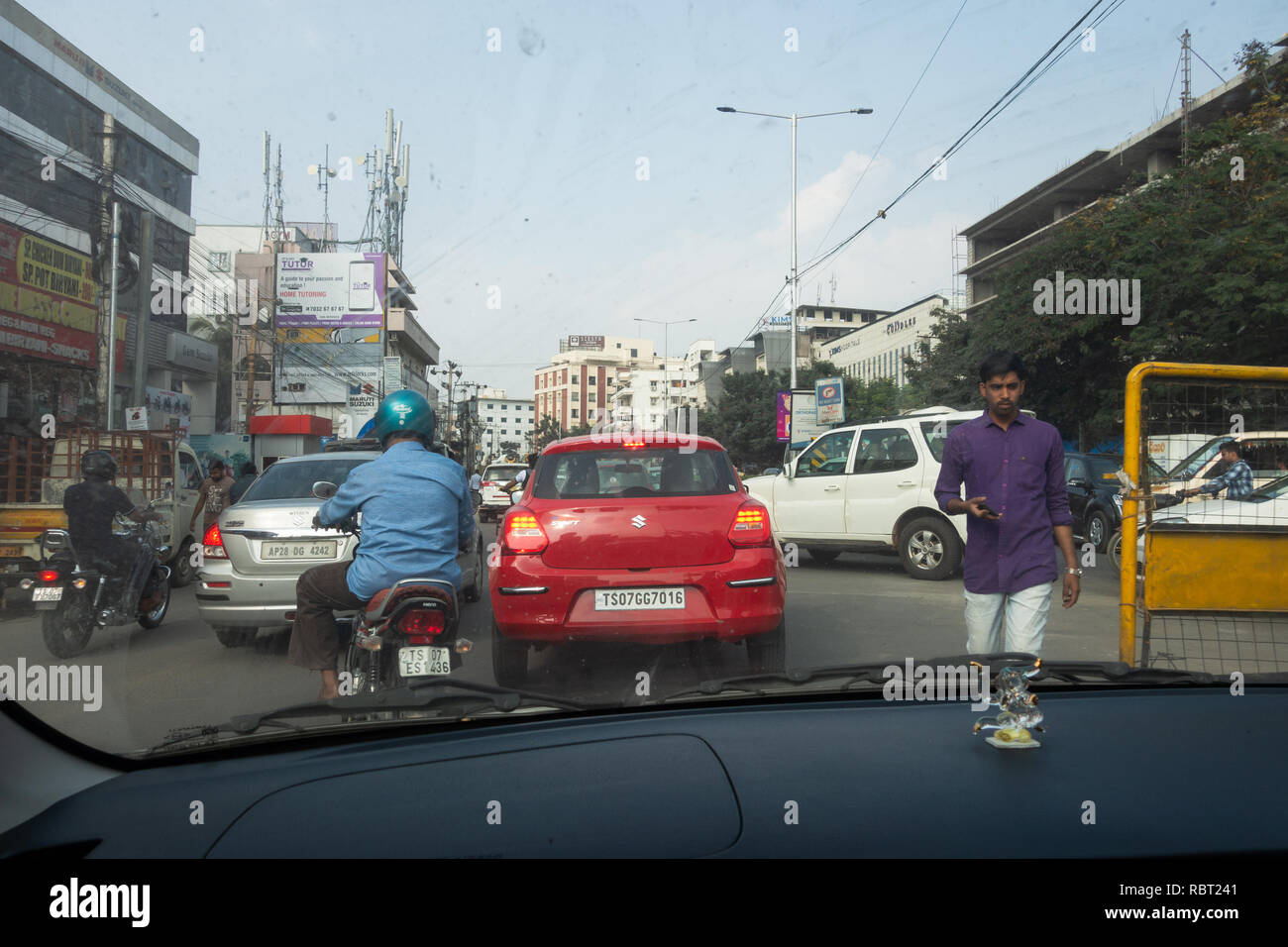 Indian people dangerously crossing the street in Hyderabad,India Stock ...