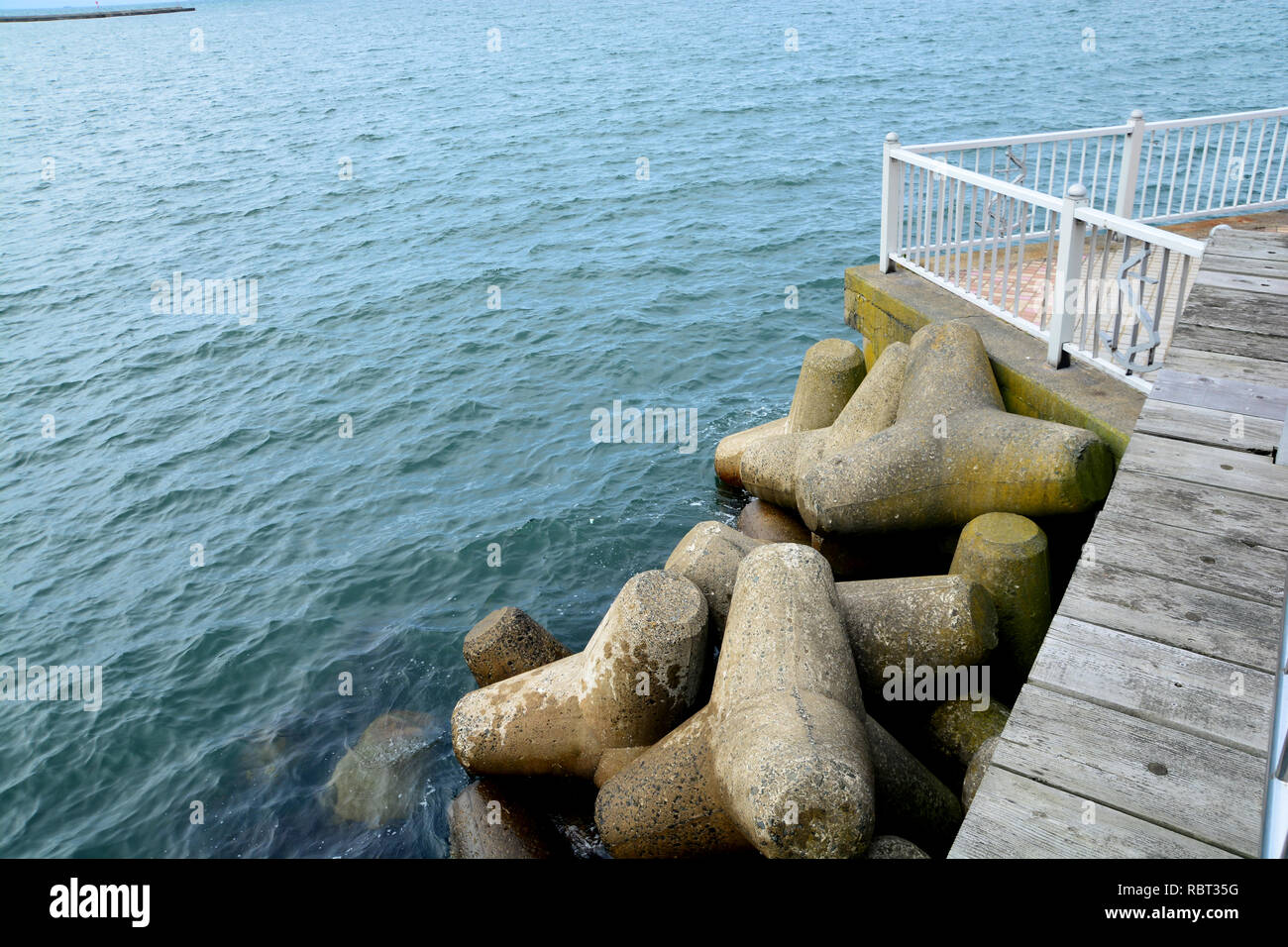 Concrete shapes used as sea wall defense from wave action Stock Photo ...