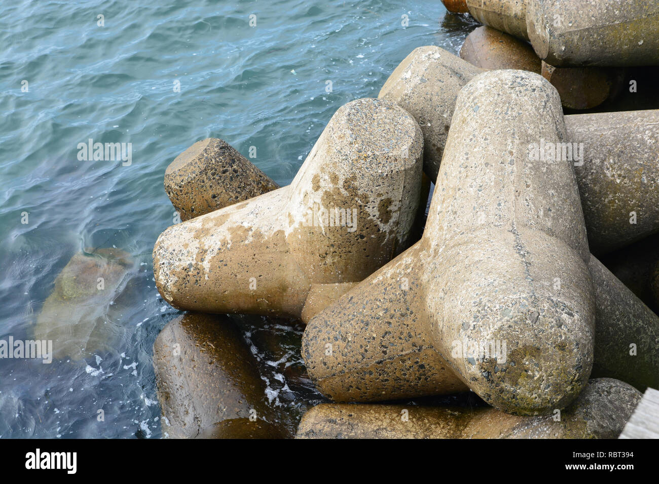 Concrete shapes used as sea wall defense from wave action Stock Photo ...