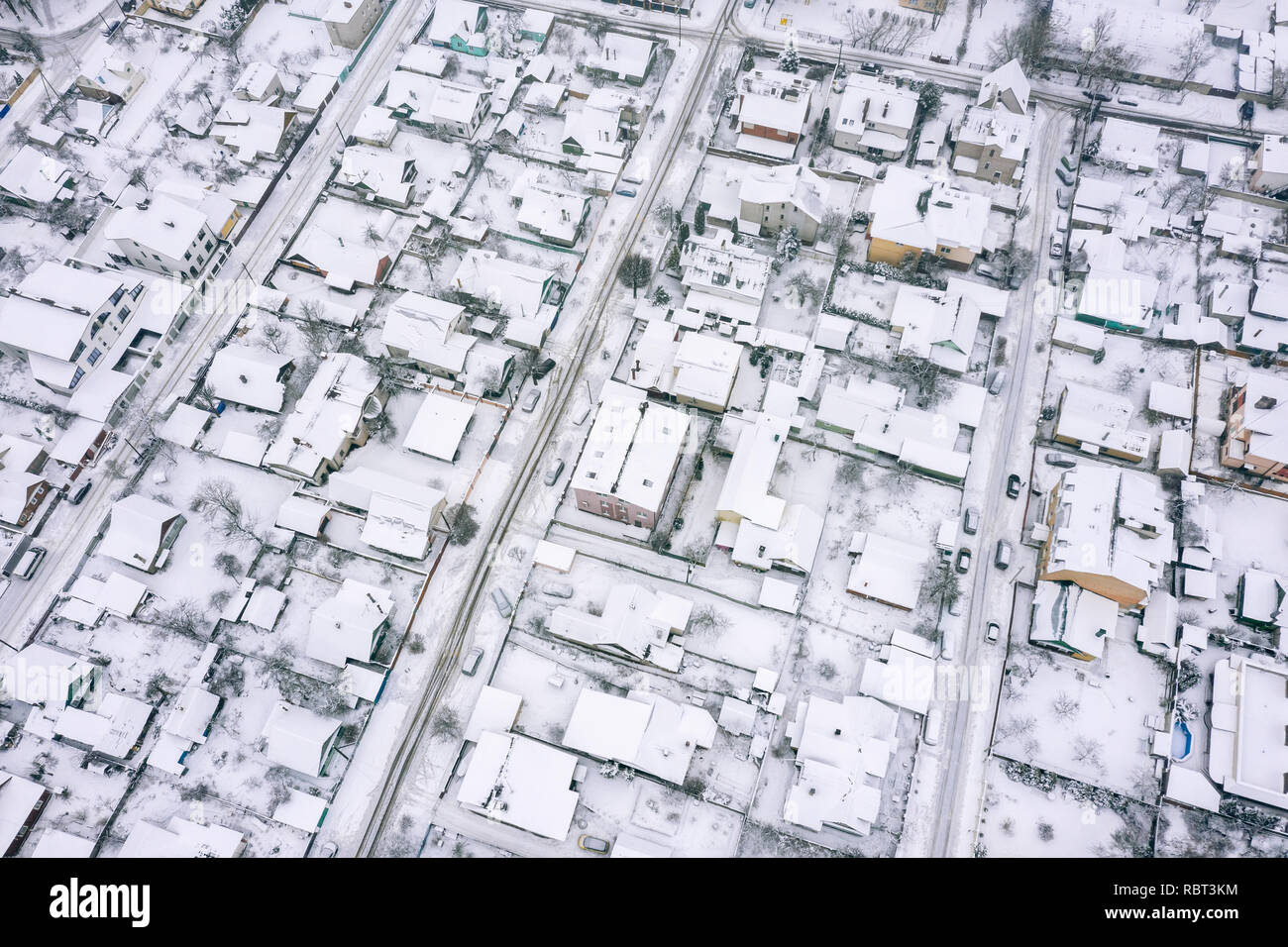 residential area in cold winter day. rooftops covered by snow. aerial ...