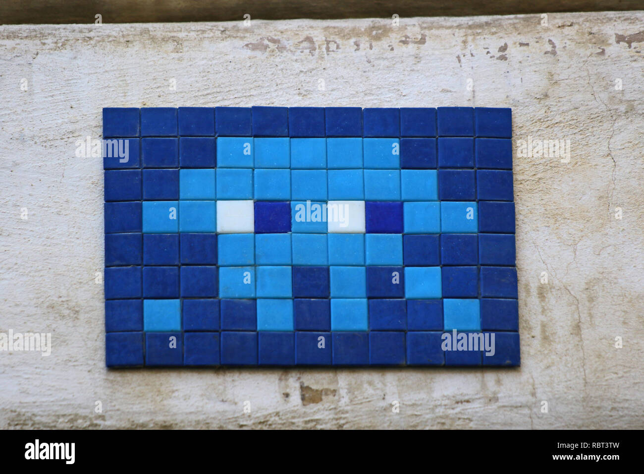 Invader art or space invader art street mosaic on a wall in Rome next ...