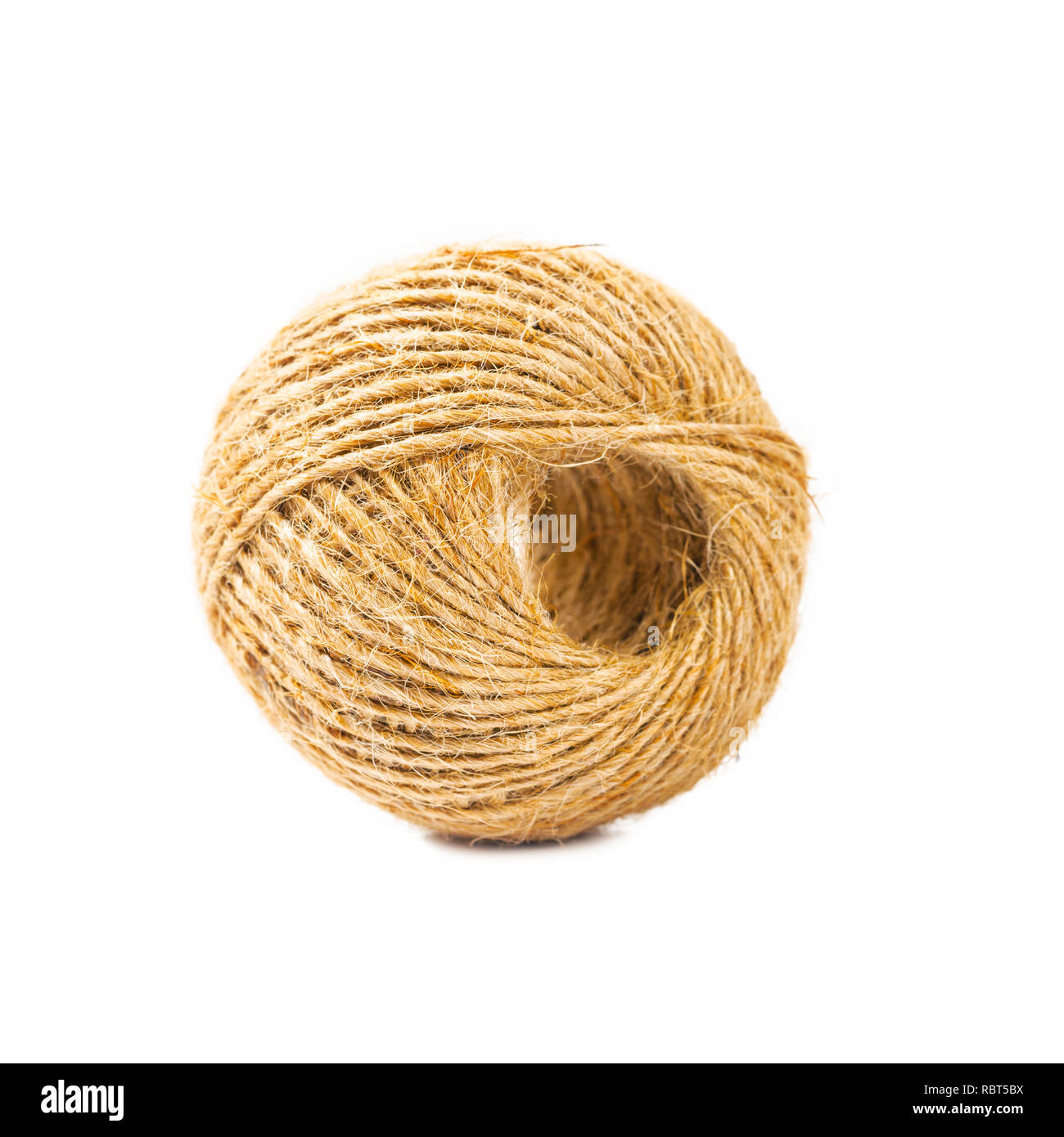 Hemp rope roll isolated on white background Stock Photo - Alamy