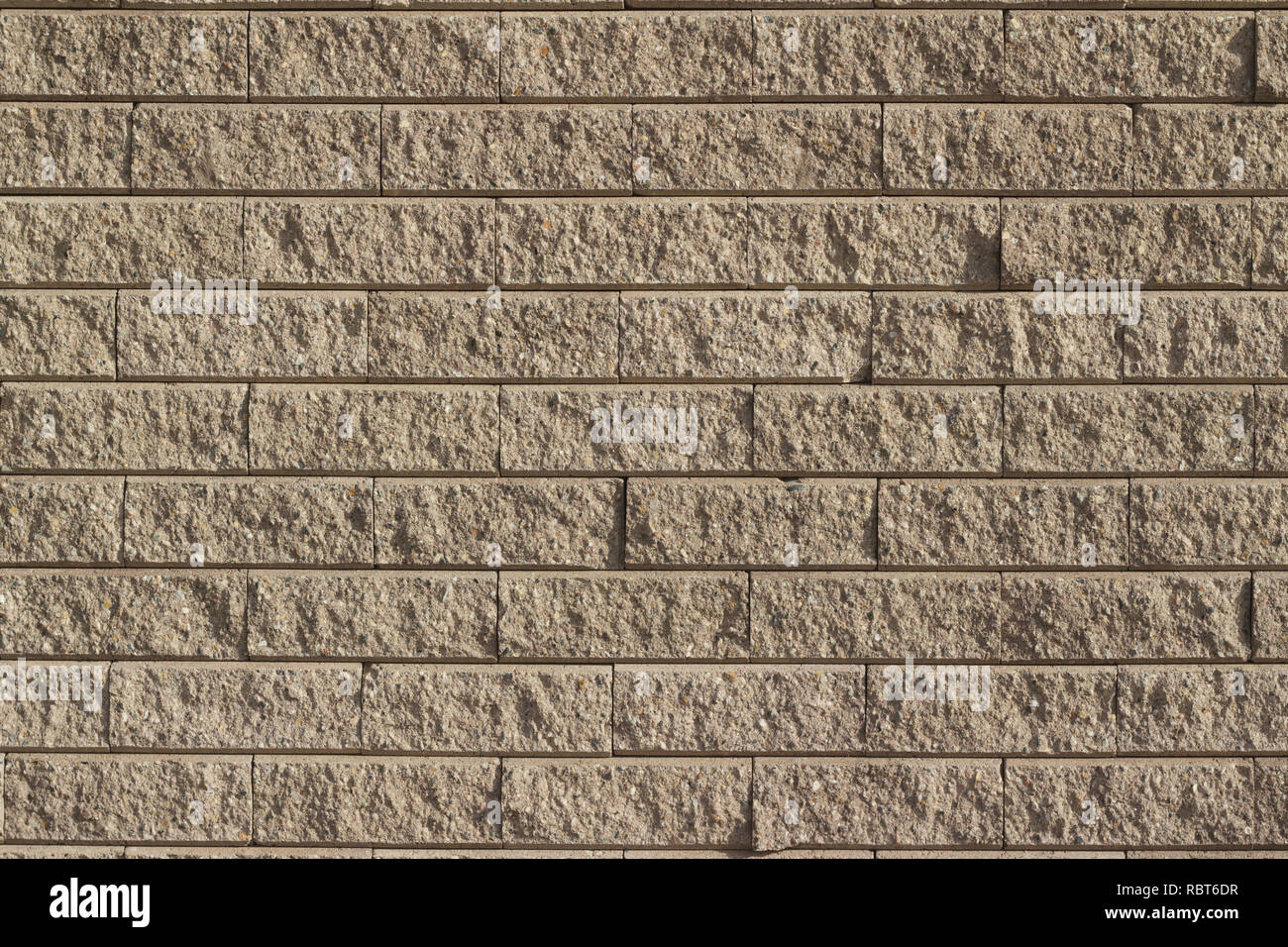 Light brown tan colored rough textured stone brick wall abstract ...