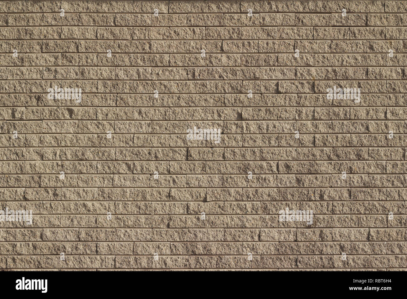 Light brown tan colored rough textured stone brick wall abstract ...