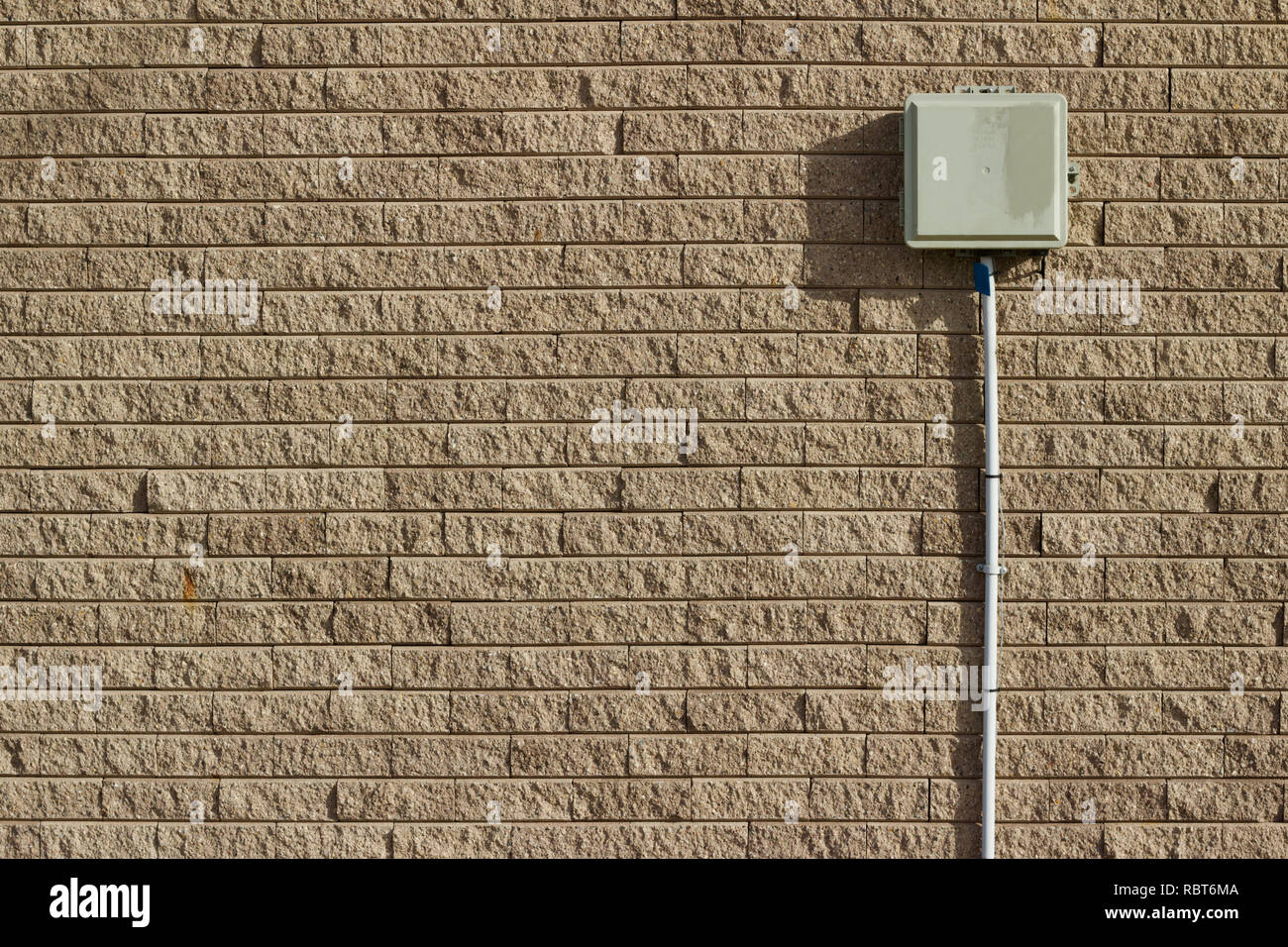 Light brown tan colored rough textured stone brick wall abstract ...