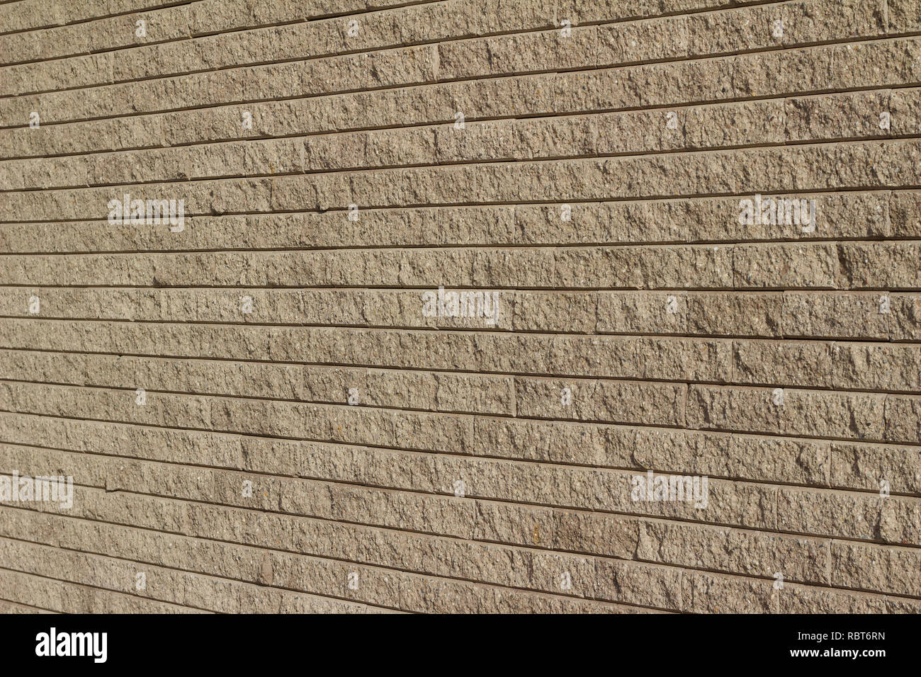 Light brown tan colored rough textured stone brick wall abstract ...