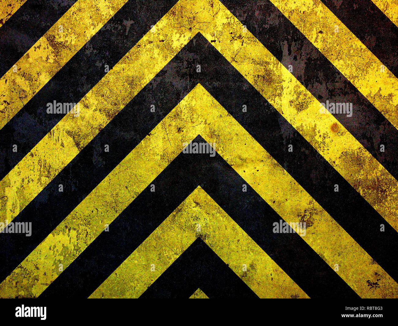 Upward pointing black and yellow under construction stripes on a dirty ...