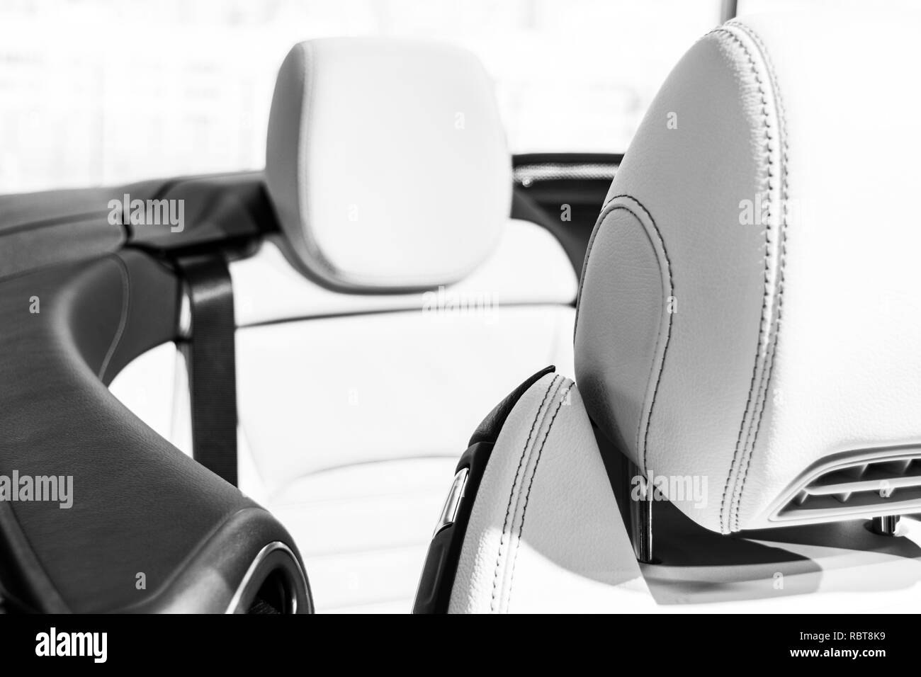 Modern luxury car perforated stitched white leather interior.Part of ...