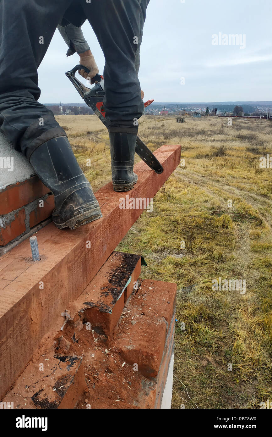 The master uses a saw to handle and cut timber beam 2018 Stock Photo ...