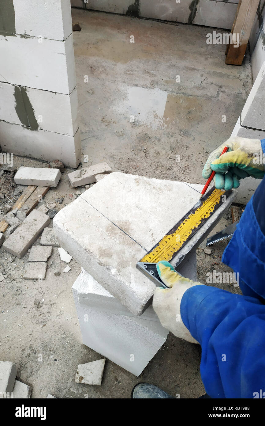 The master applies the dimensions to the block using the angle ruler ...