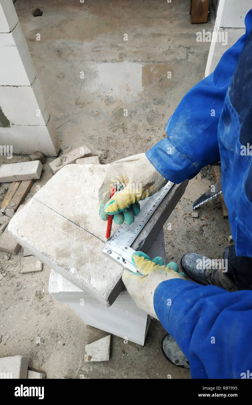 The master applies the dimensions to the block using the angle ruler ...