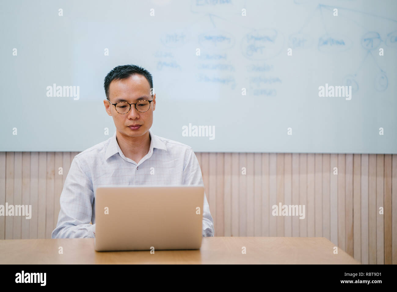 Portrait of an Asian Chinese professional man in shirt and pants ...