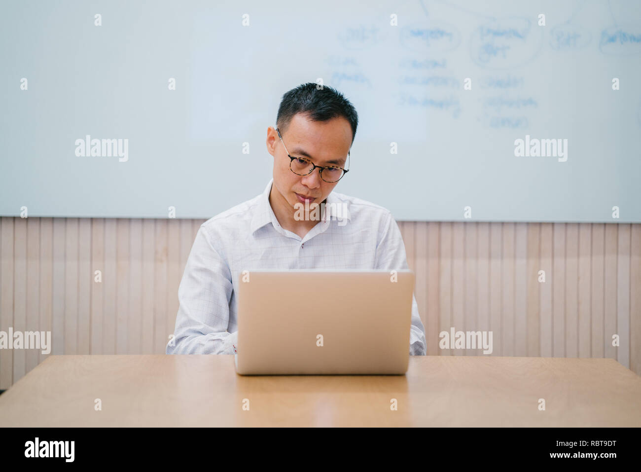 Portrait of an Asian Chinese professional man in shirt and pants ...
