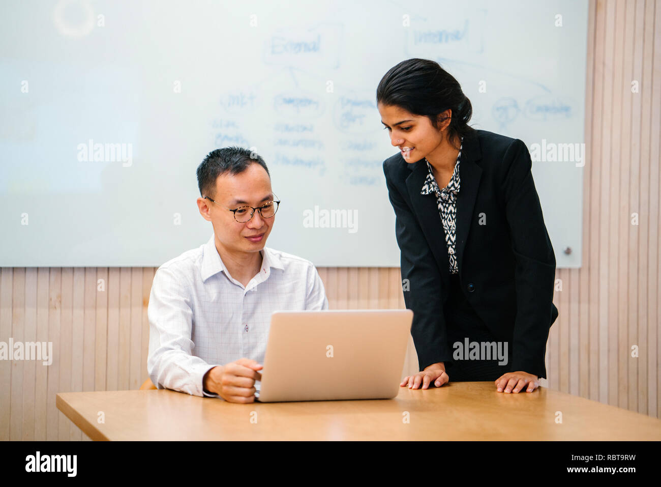 A Chinese professor or teacher has a discussion with his Indian student ...