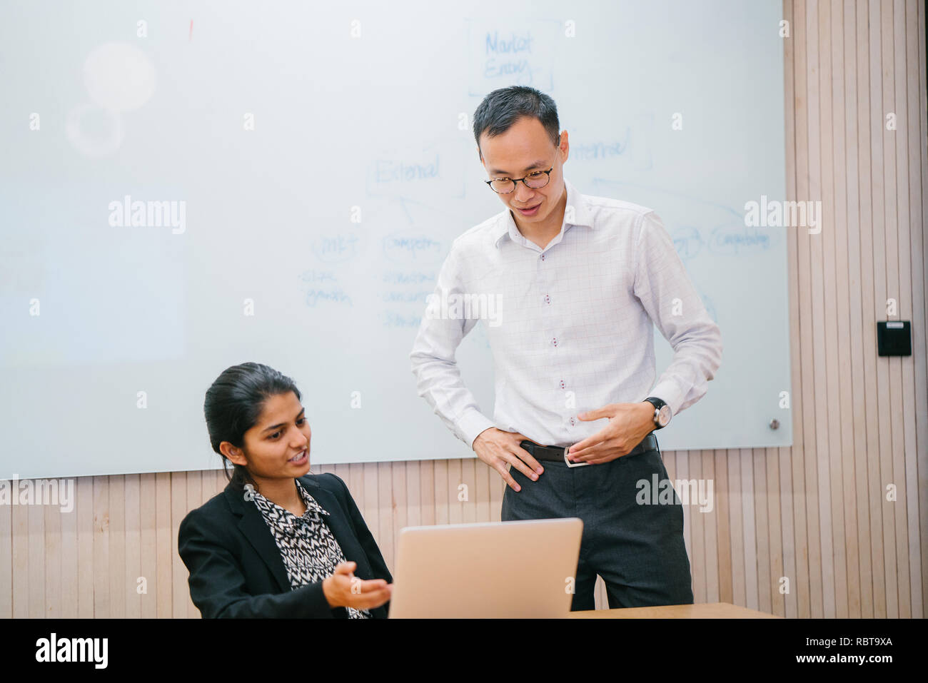 A Chinese professor or teacher has a discussion with his Indian student ...