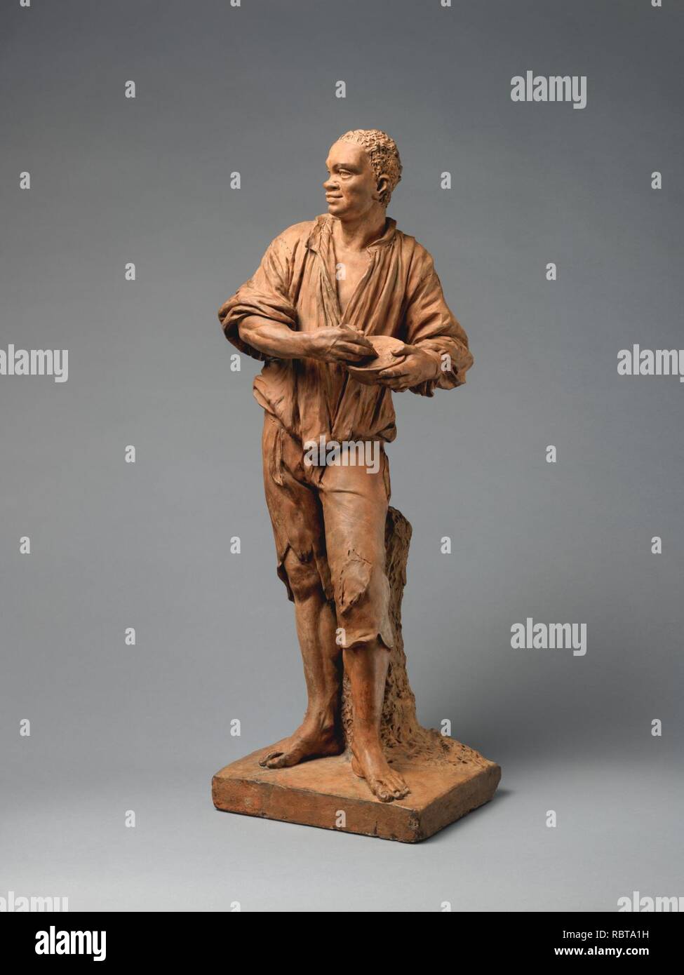 A Man in Ragged Clothes with a Mixing Bowl Stock Photo - Alamy