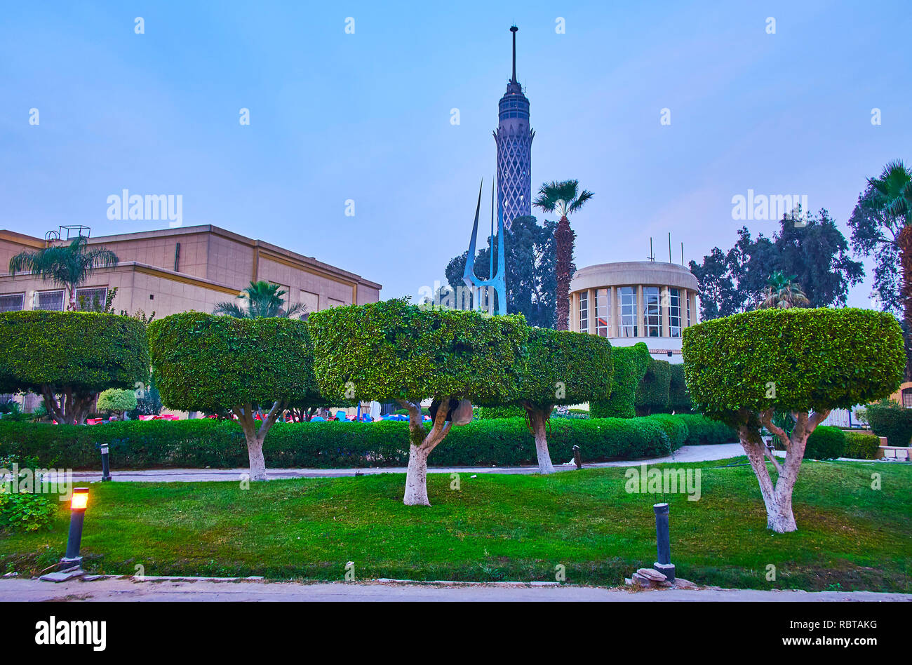 The ornamental garden of National Cultural Centre with trimmed trees ...