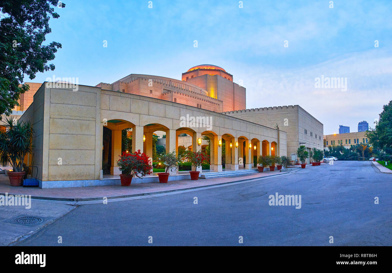 The evening walk at the scenic modern building of Cairo Opera House ...