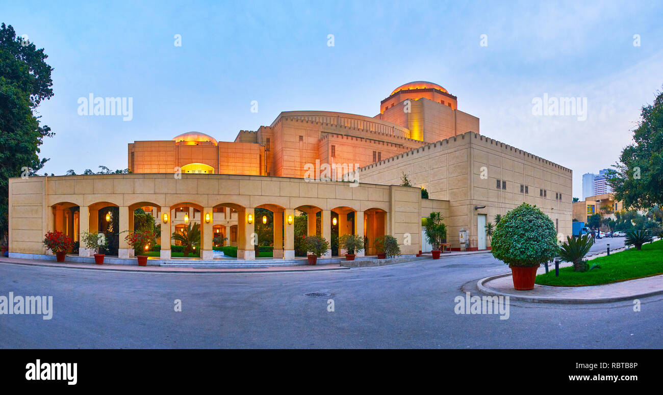 Panorama of the stone building of Opera House in dimmed evening lights ...