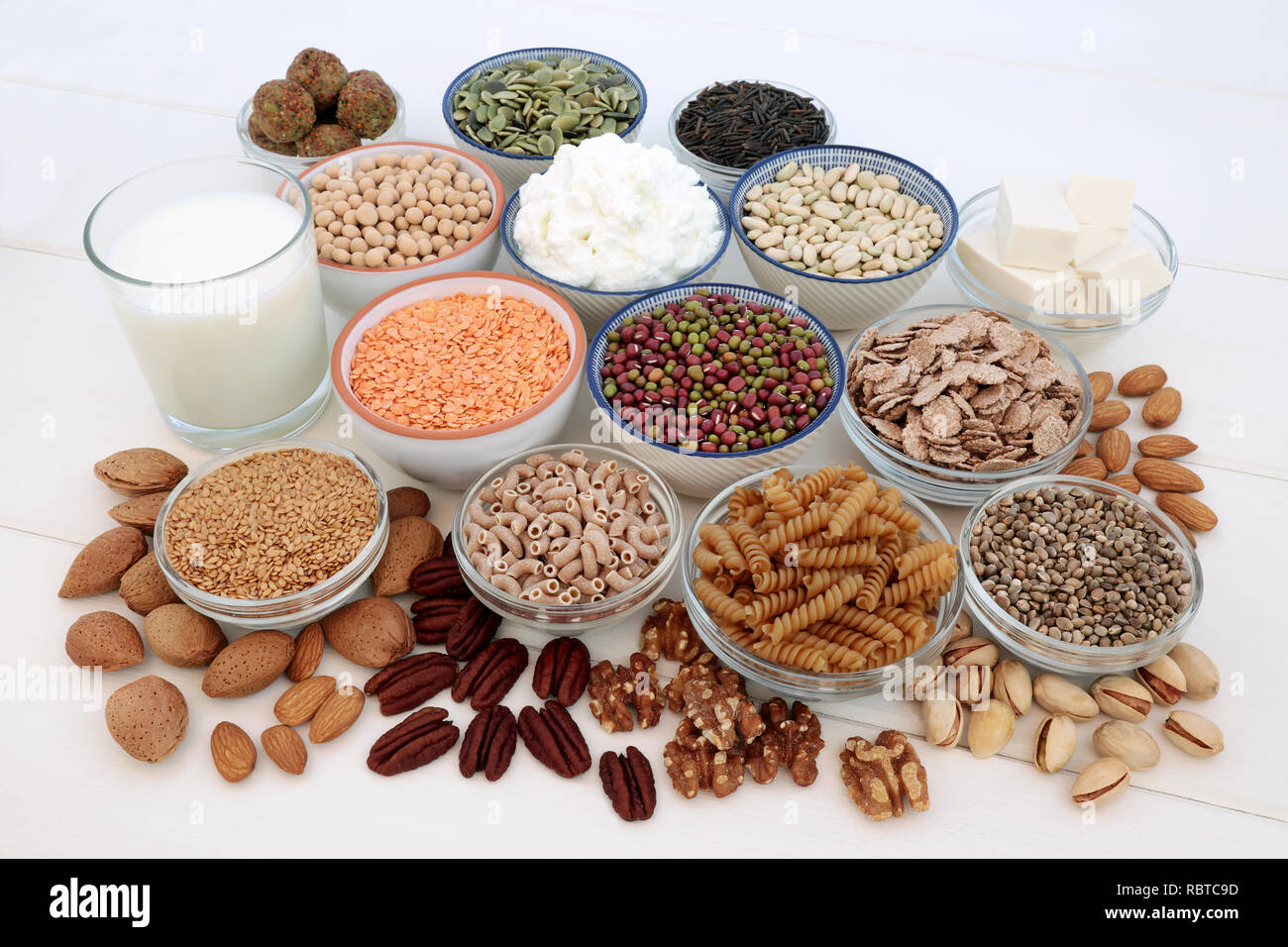 Health food for vegans with tofu bean curd, legumes, pasta, grains ...