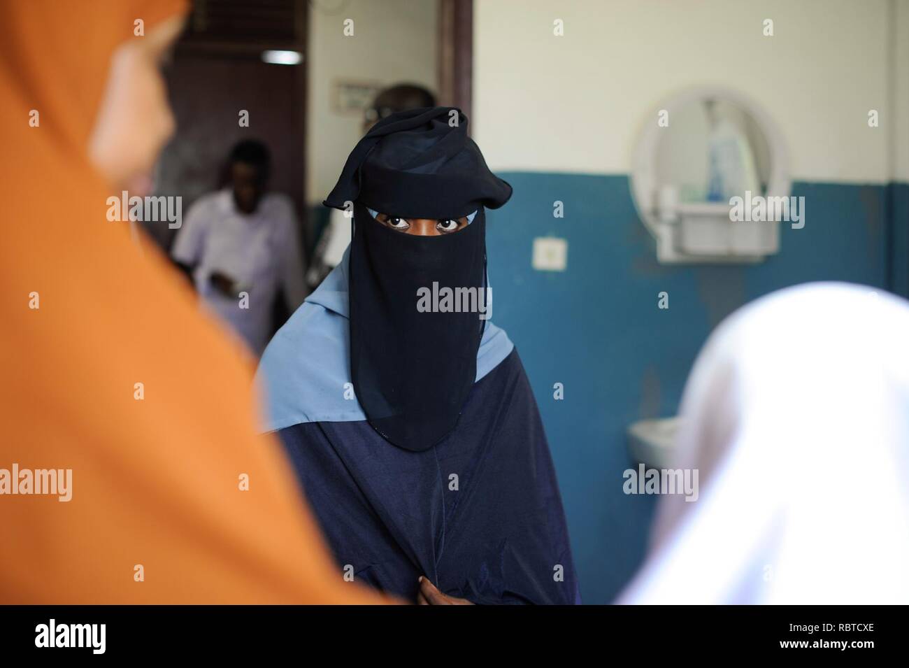 A university student in Mogadishu, Somalia, talks to Dr. Lul Mahamud ...