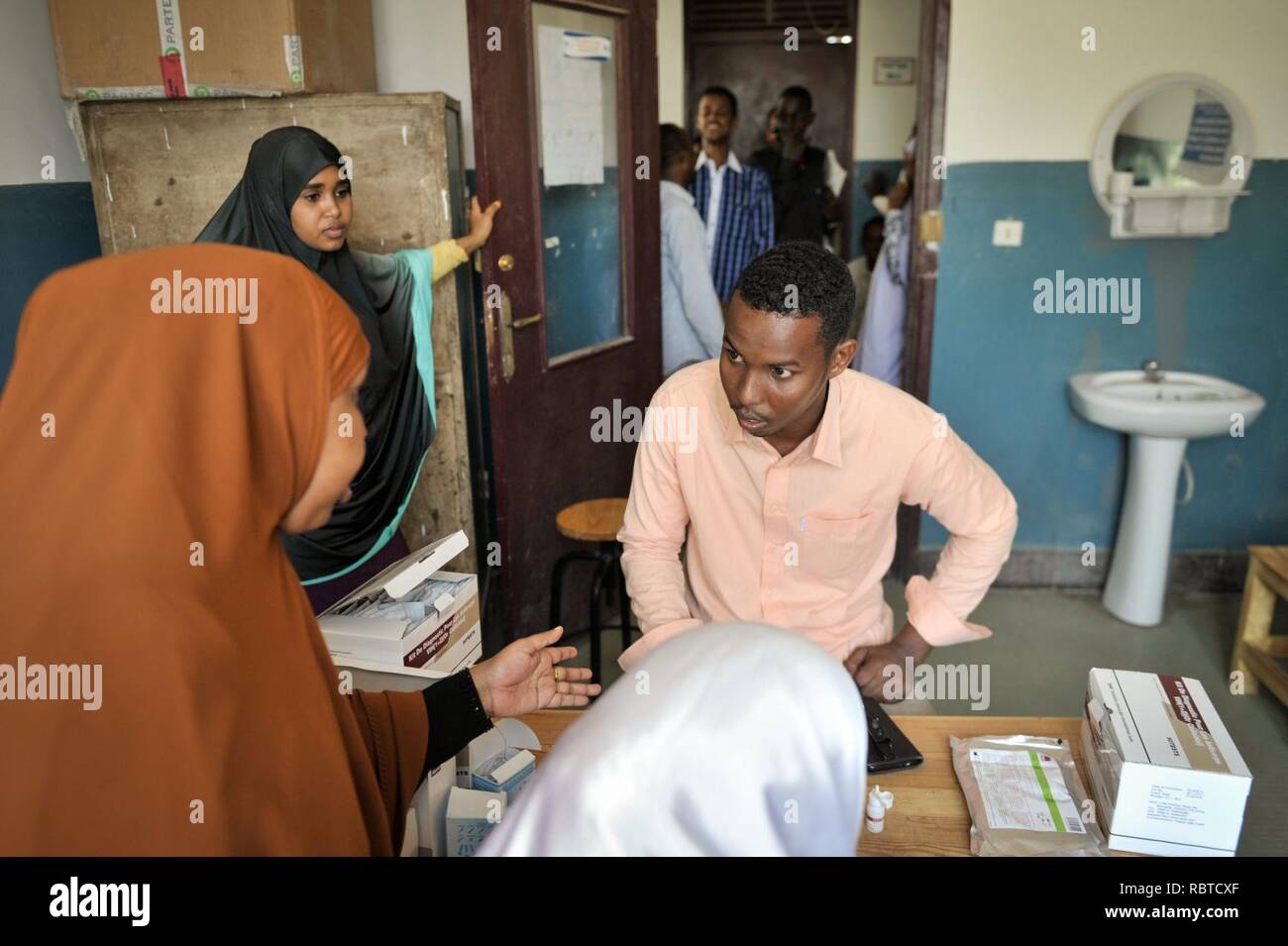 A university student in Mogadishu, Somalia, talks to Dr. Lul Mahamud ...