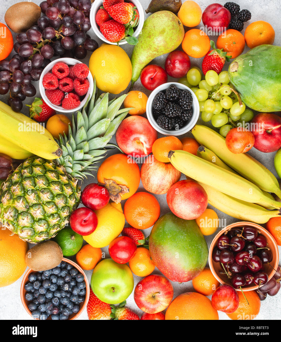 Healthy fruit background filled with strawberries raspberries oranges ...