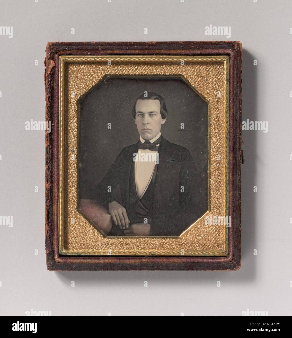 -Seated Young Man with Arm Resting on Table Stock Photo - Alamy