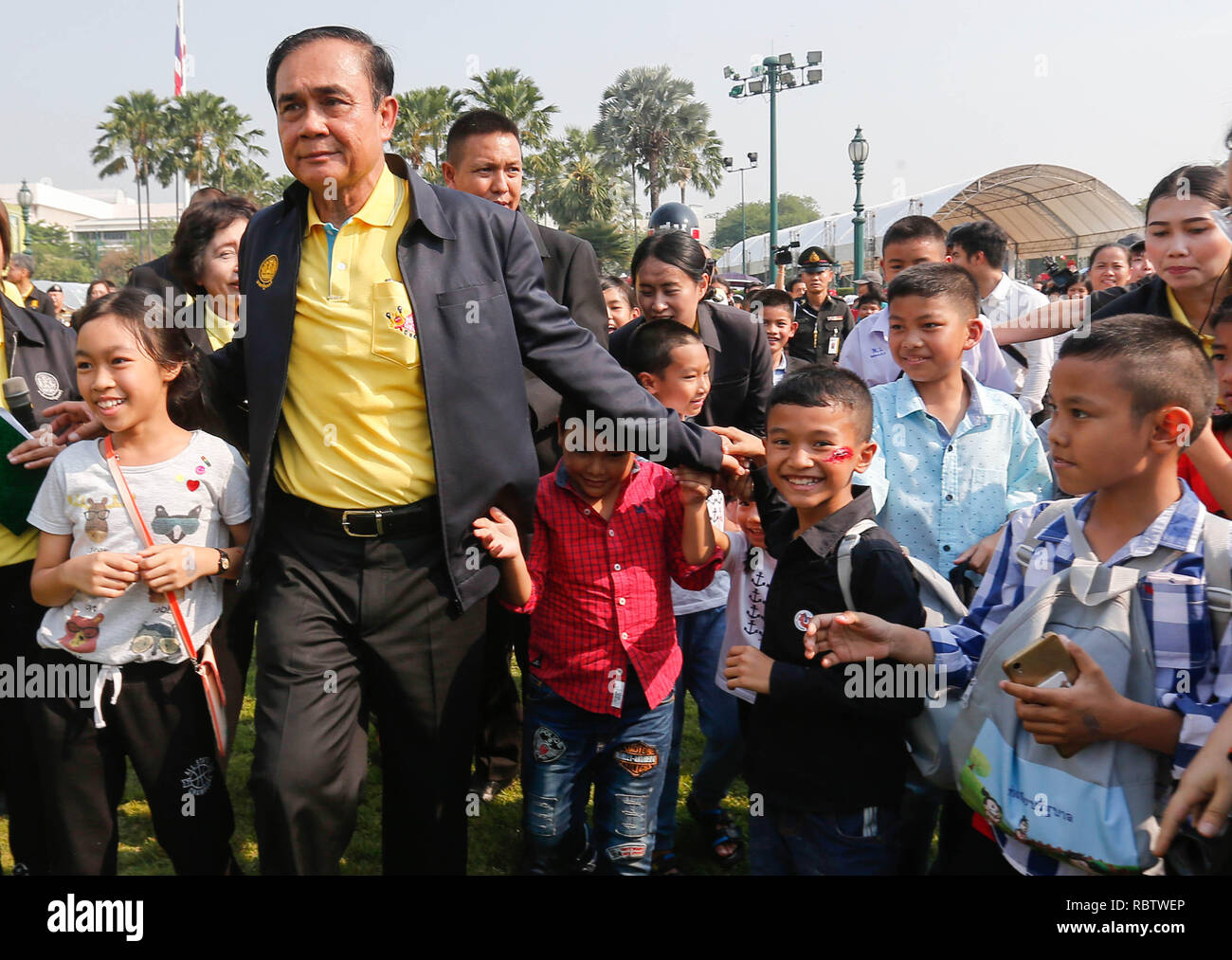 Thailand's Prime Minister Prayuth Chan-ocha walks with children during ...