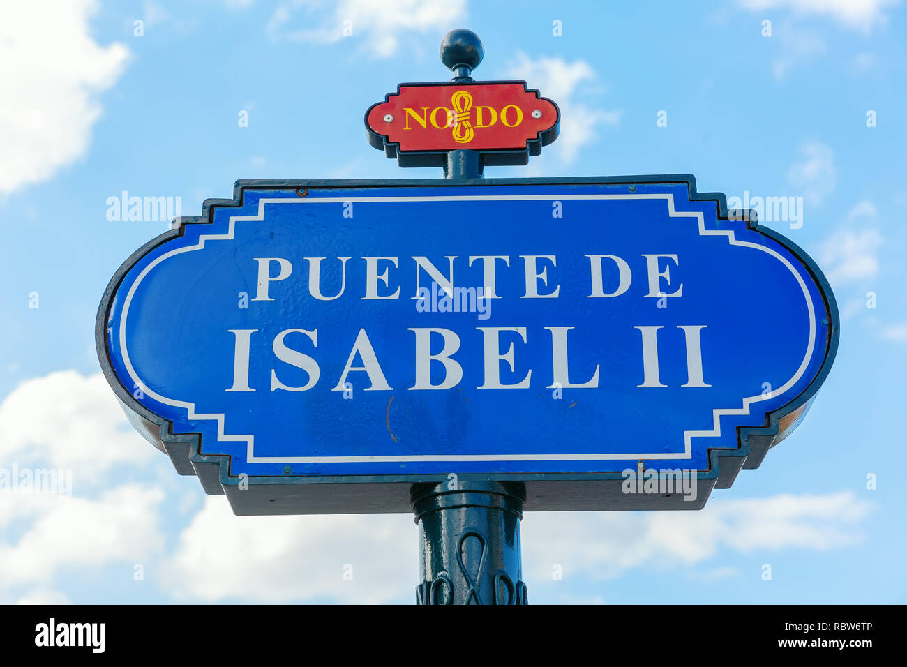 street name sign of the historic bridge Puente de Isabel II, Seville ...
