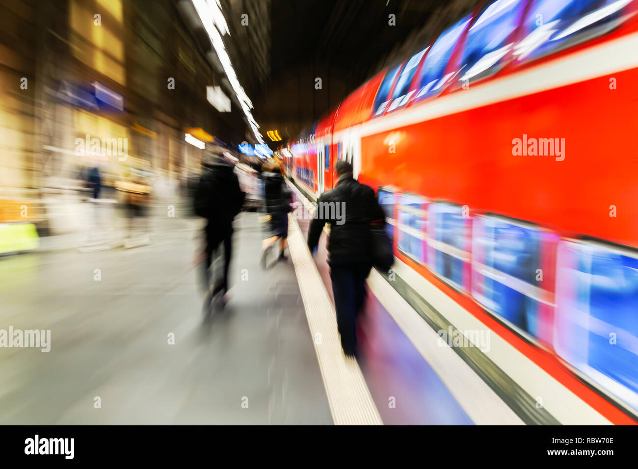 scene at a train station with camera made zoom effect Stock Photo - Alamy