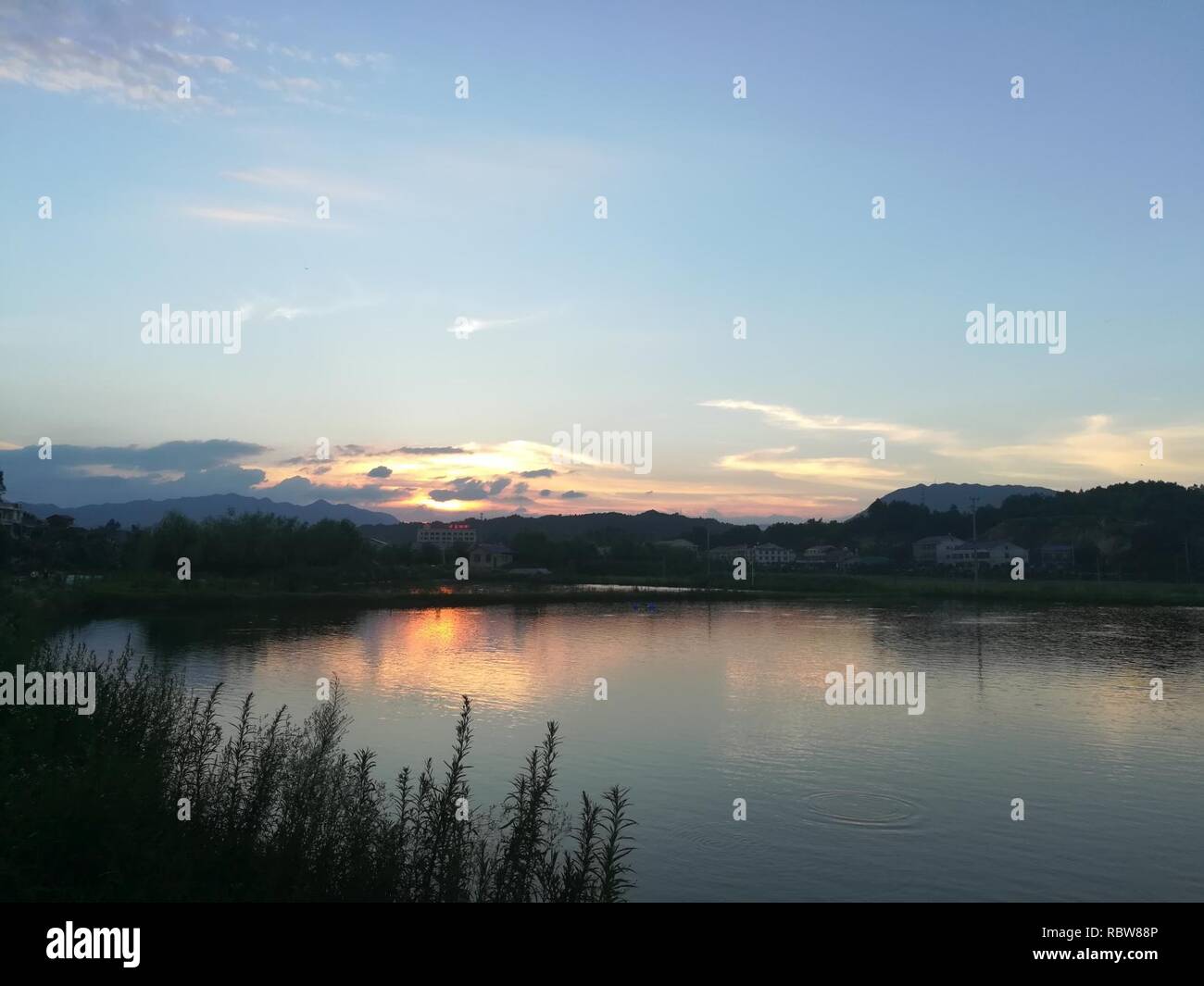 dav A distant view of Qingshanqiao Town, Hongjia Mountain (left) and ...