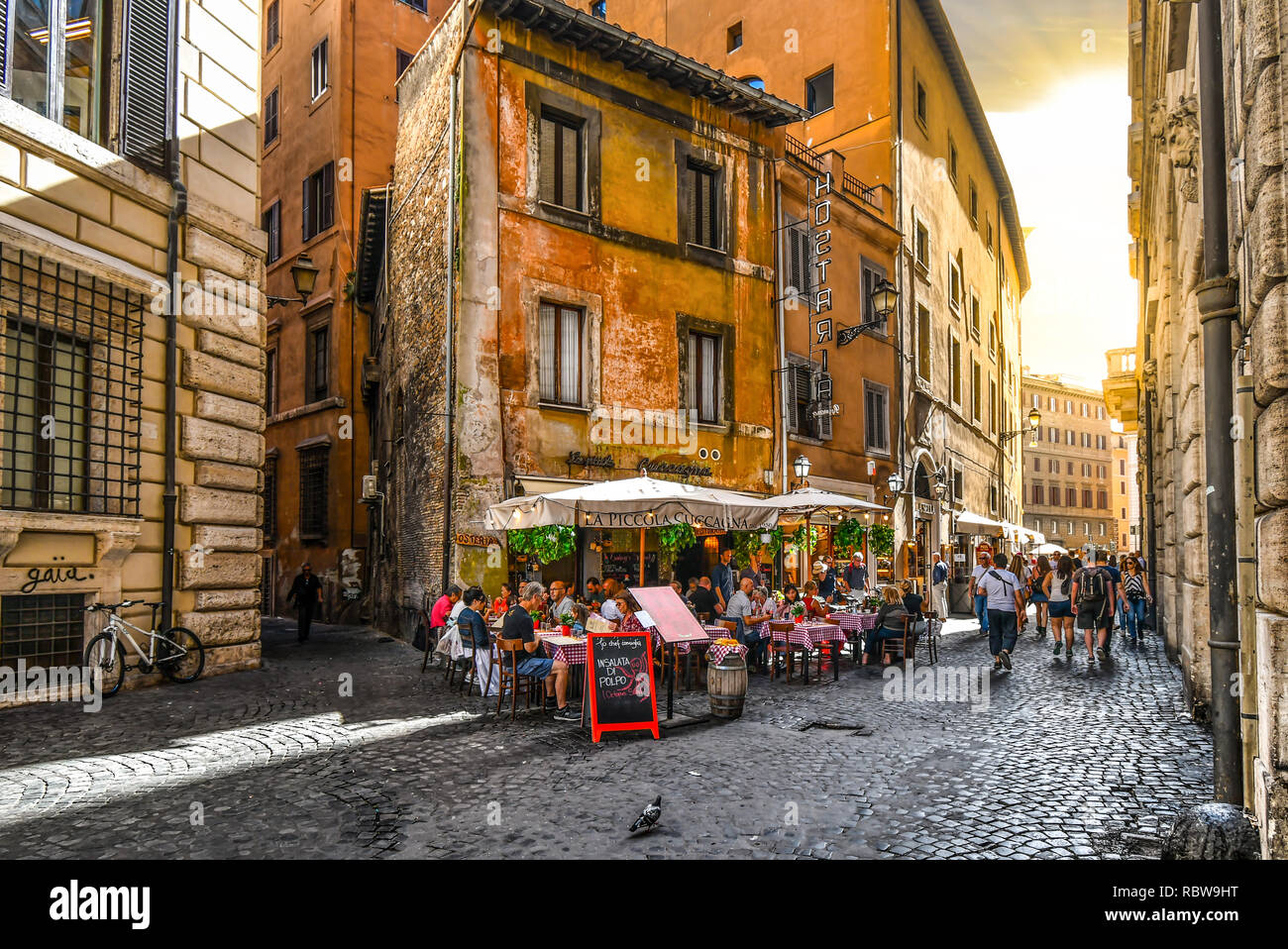 Tourists and locals enjoy a late afternoon shopping and dining at a ...