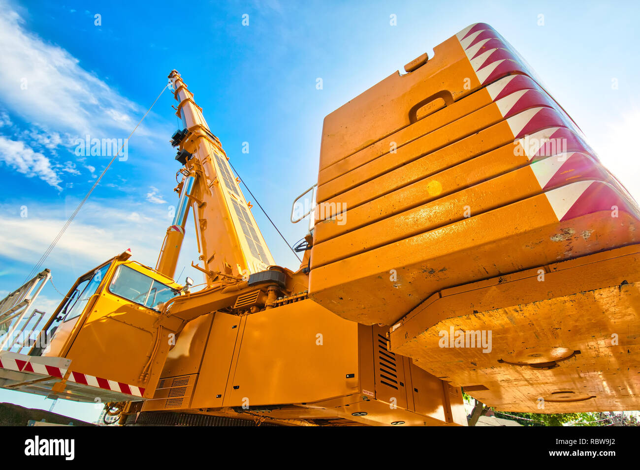 Mobile crane at work at downtown construction site Stock Photo - Alamy
