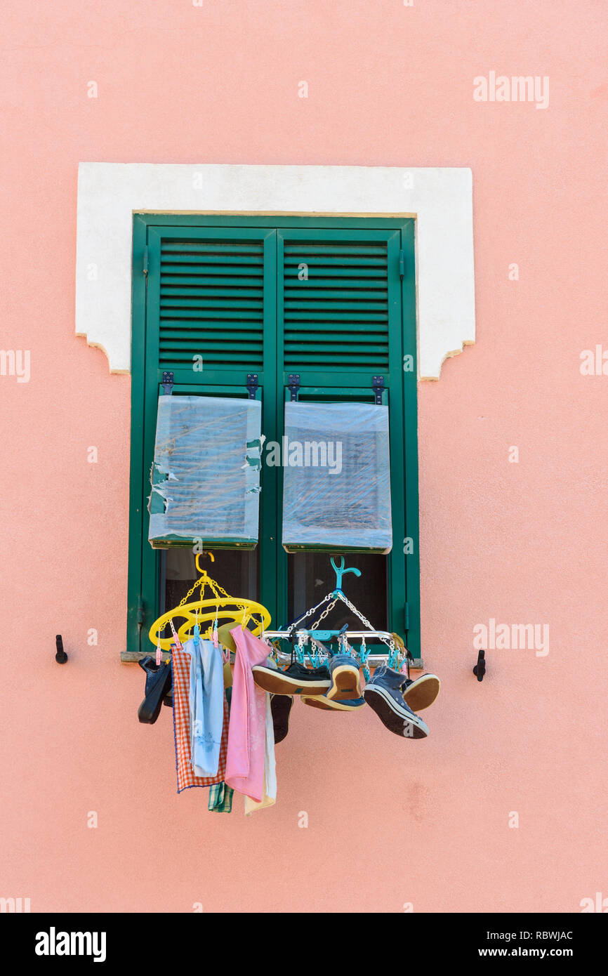 Hanging from windows hi-res stock photography and images - Alamy