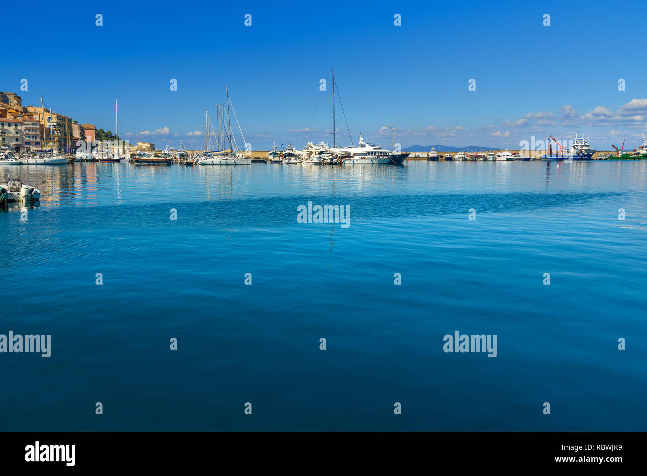 View of harbor seafront in seaport town Porto Santo Stefano in Monte ...
