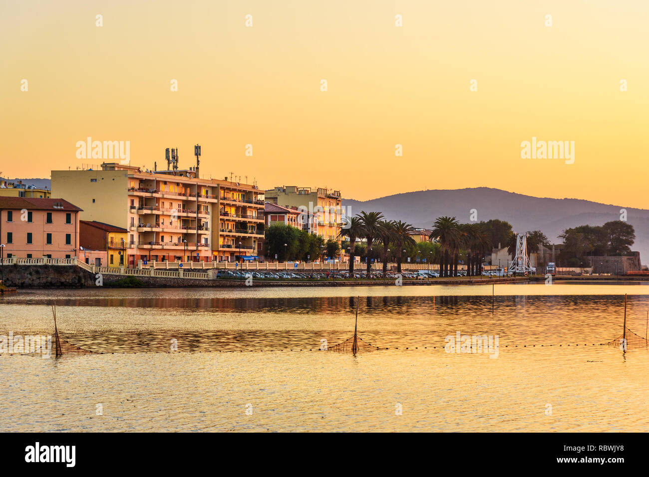 View of Orbetello in lagoon on peninsula Argentario at sunrise. Tuscany ...