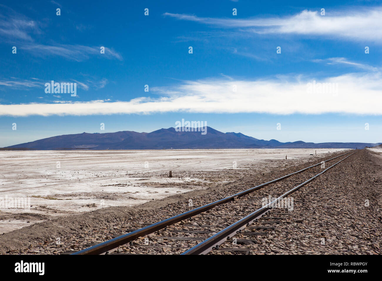 Old abandoned railway tracks run across the salt plain on the Salar de ...