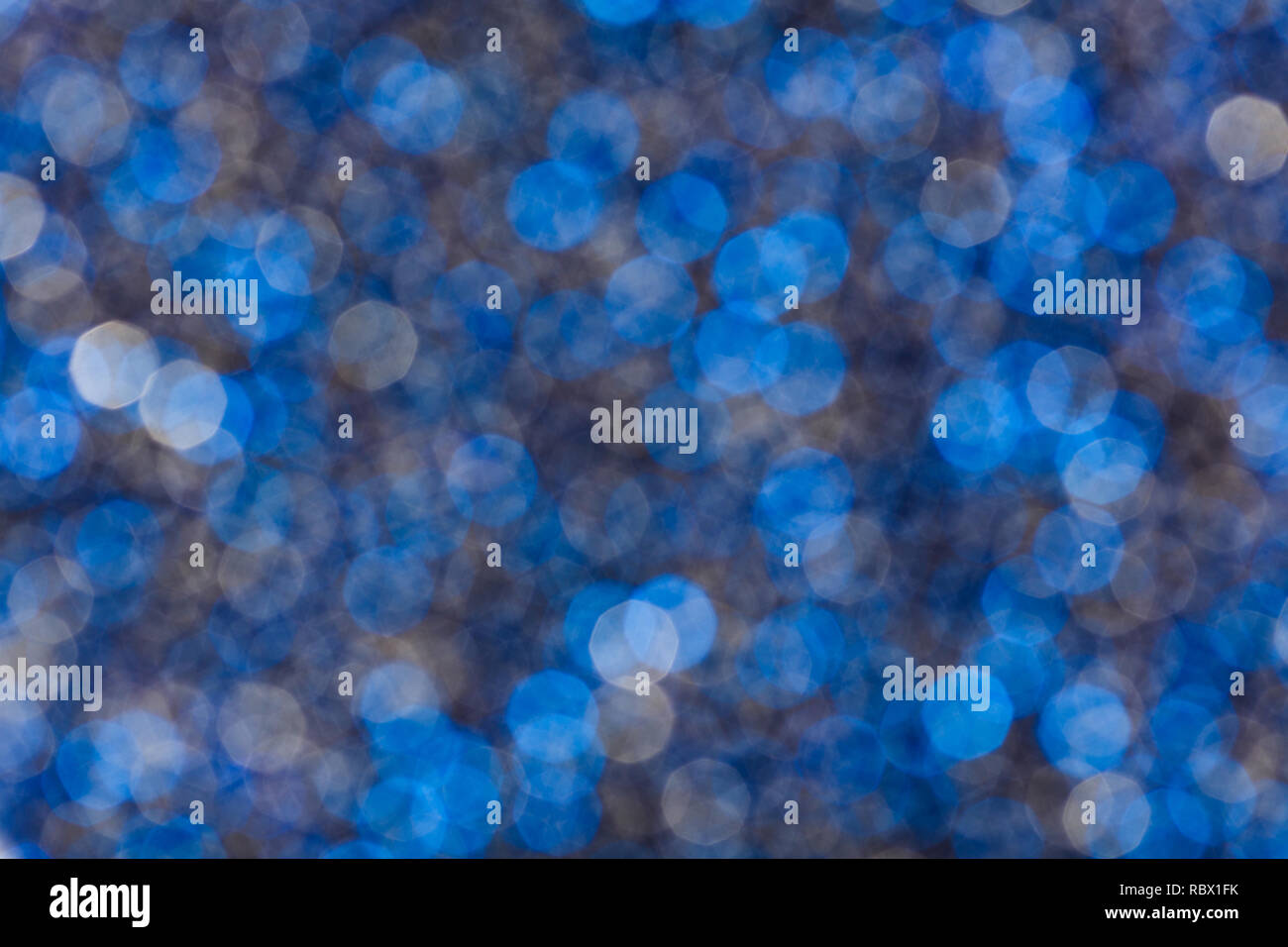 Soft de-focused bright blue sparkle lights background Stock Photo - Alamy